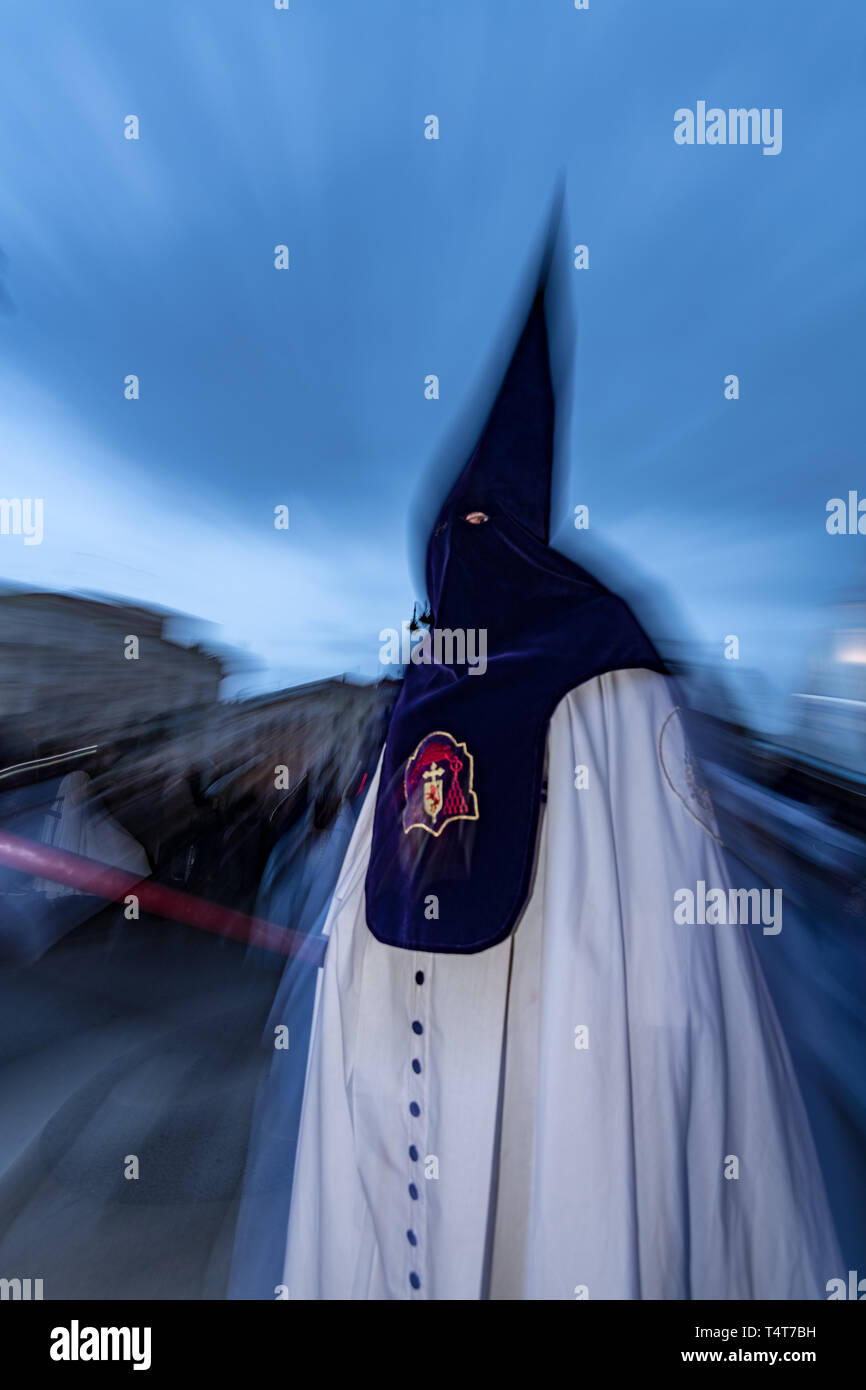 Catholics wearing capirotes, cloaks and hoods, belonging to the ...