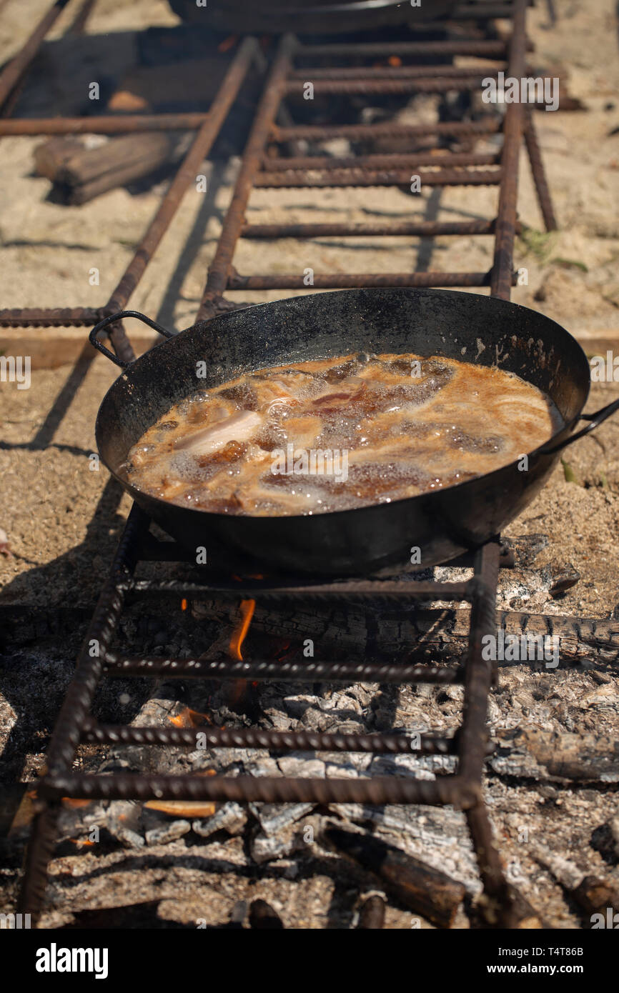 Cooking on fire Stock Photo - Alamy