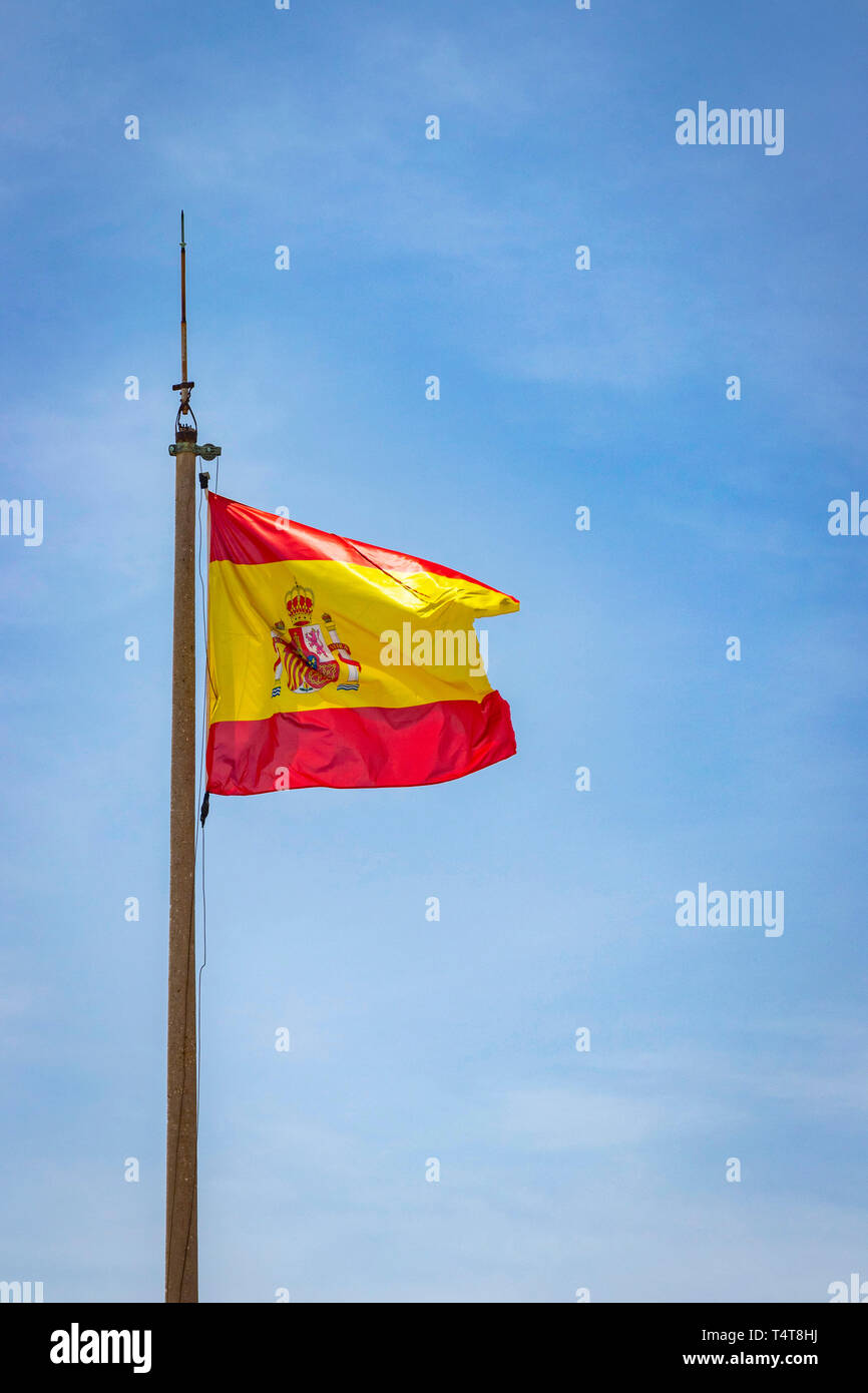 Spanish flag flying against blue sky above Santa Barbara Castle ...
