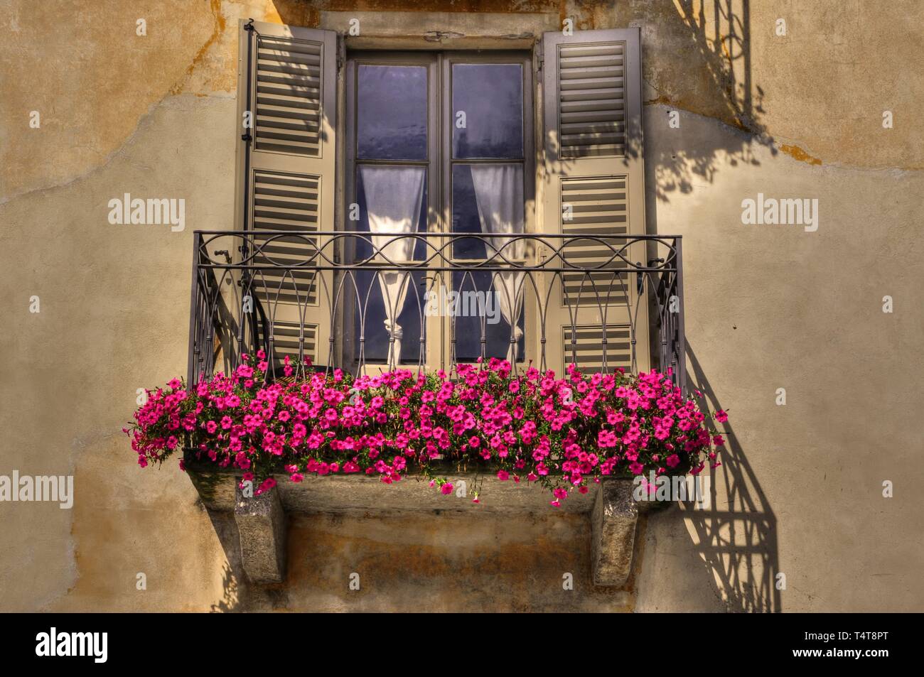 Balcony with red flowers hi-res stock photography and images - Alamy