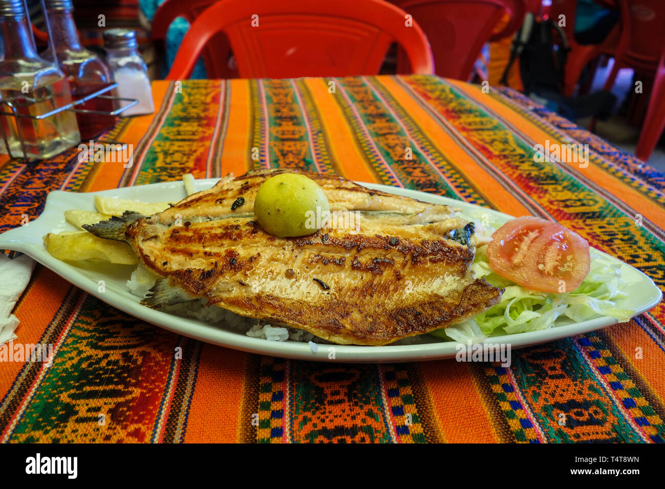 Famous fish plate - grilled trout with some rice, lemon and salat - in ...