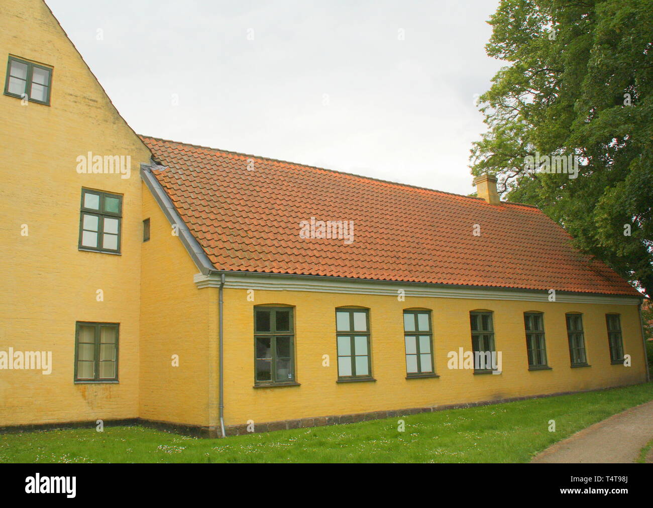 Stege. June-12-2017. Old city gate Mølleport and Mønsmuseum in Stege on ...