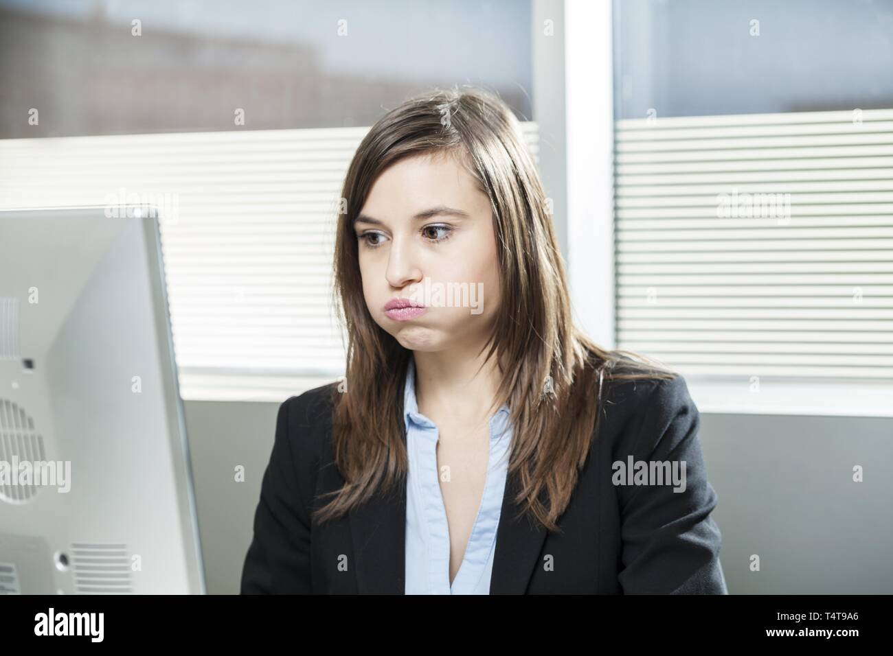 Young woman is overburdened, office Stock Photo - Alamy