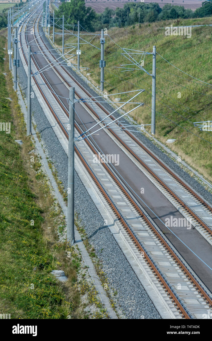 Modern multi-track railway line with overhead lines Stock Photo - Alamy