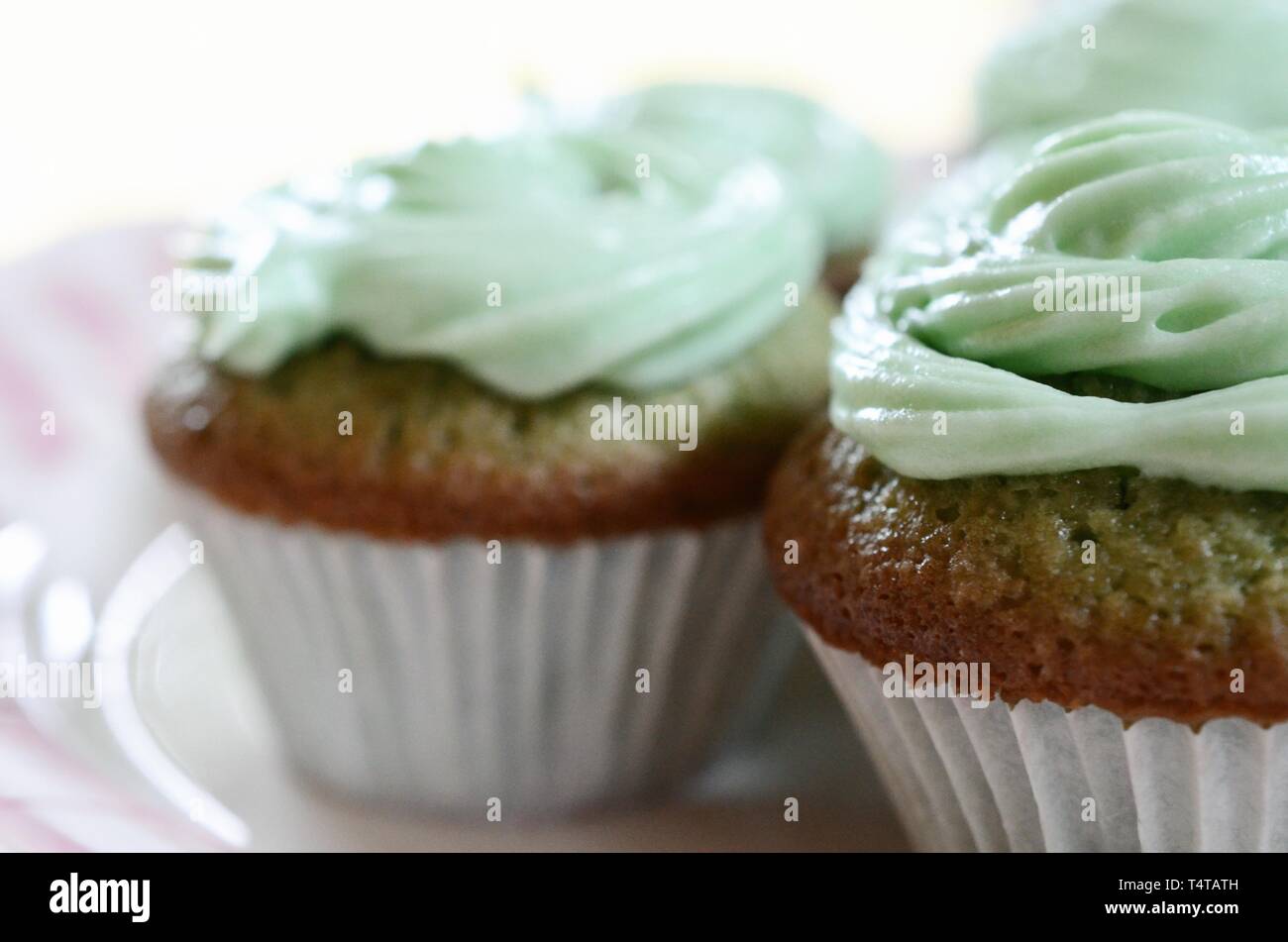 Cupcakes with green icing Stock Photo - Alamy