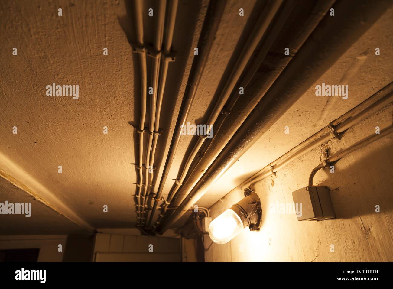 Power lines at basement ceiling Stock Photo - Alamy