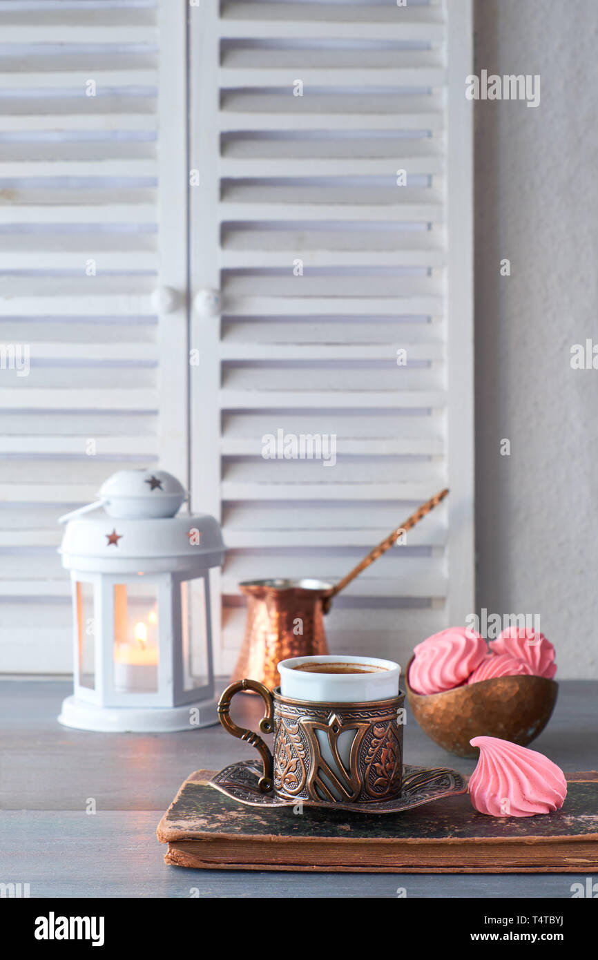 Oriental coffee cooked in traditional Turkish copper coffee pot and ...