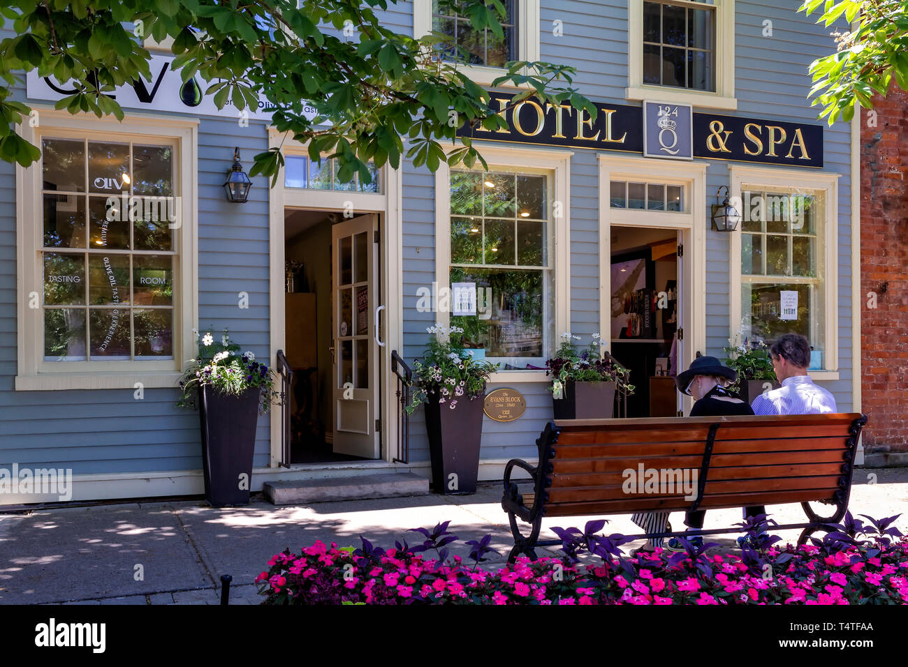 The colorful shops and restaurants in the main street of the city are ...