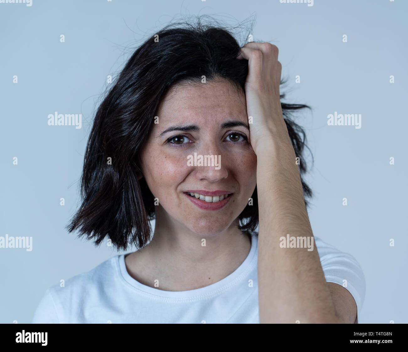 Close up portrait of sad latin woman serious and concerned, looking ...