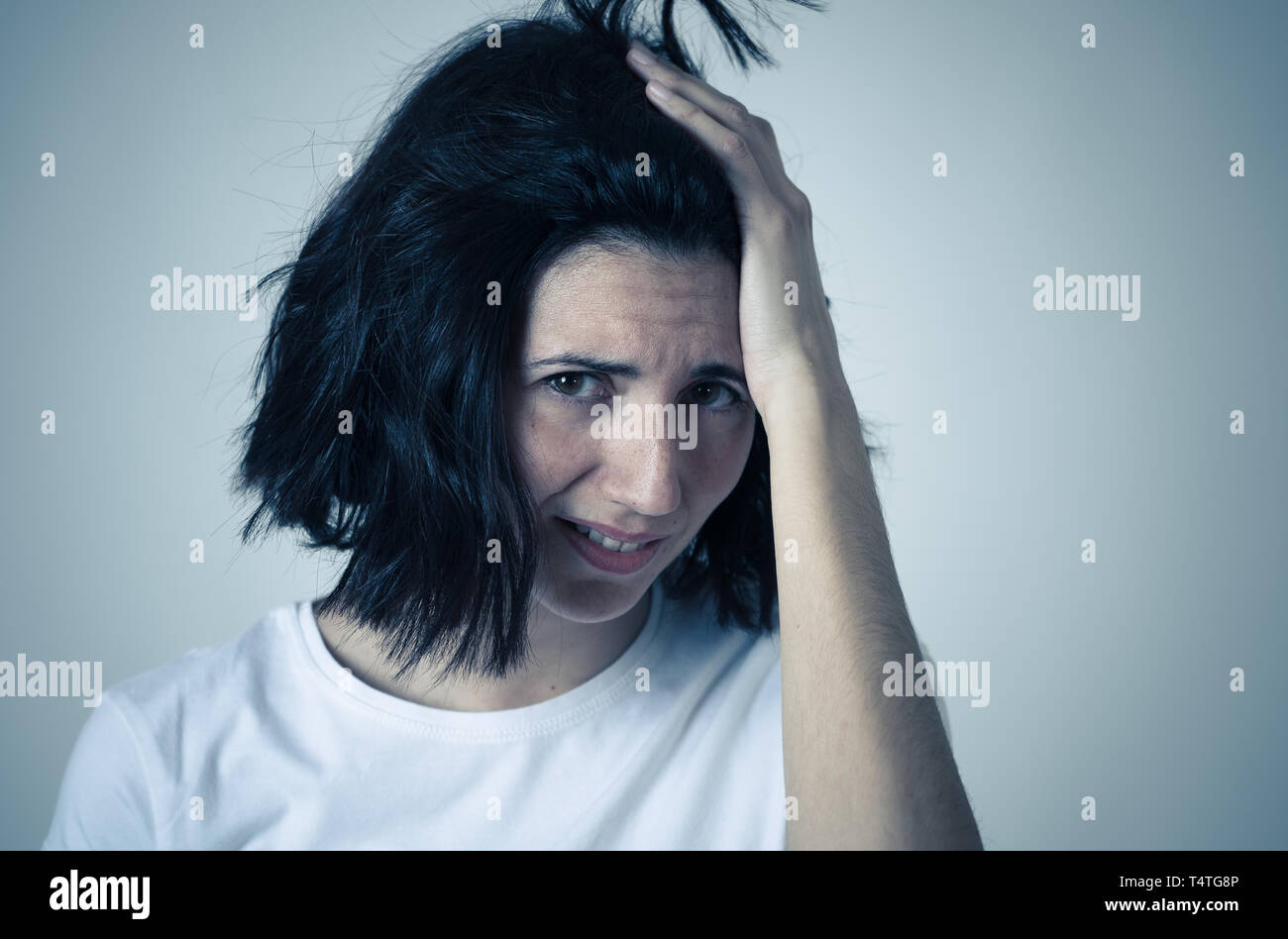 Close up portrait of sad latin woman serious and concerned, looking ...