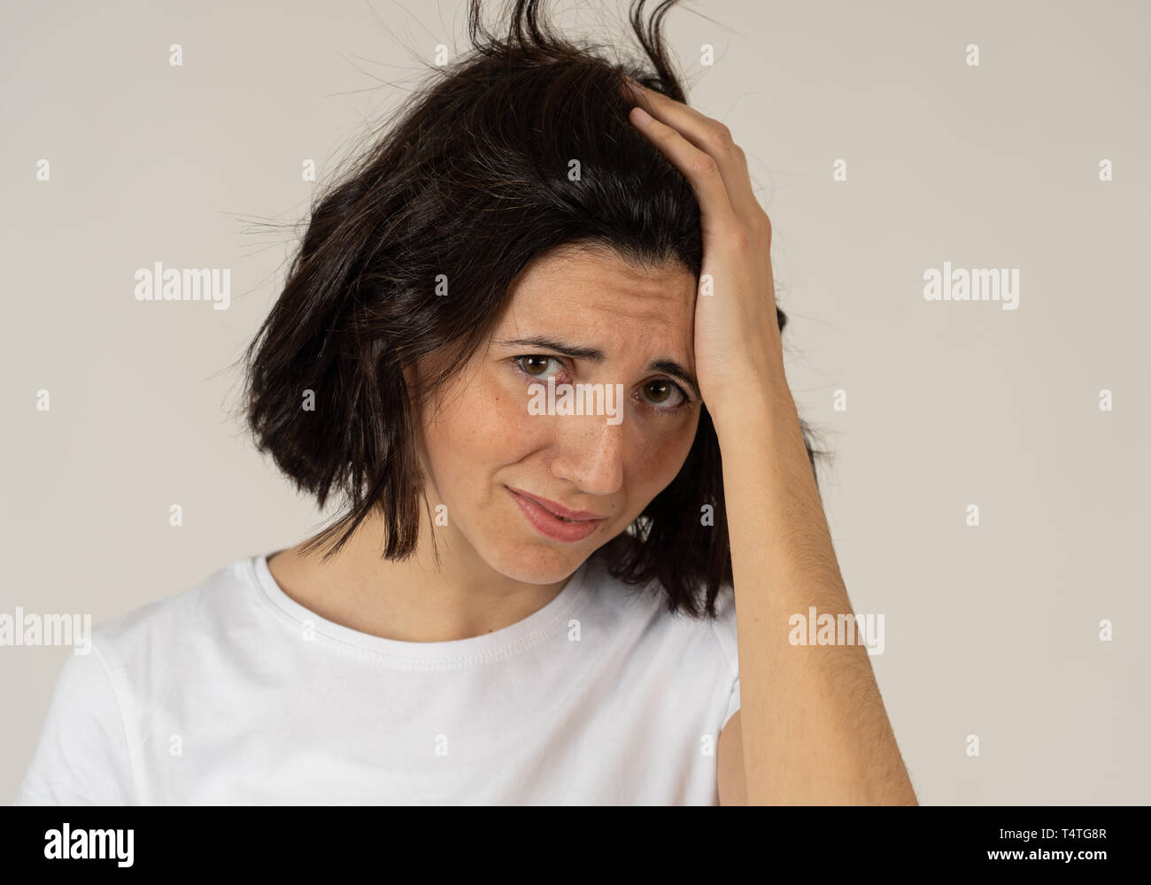 Close up portrait of sad latin woman serious and concerned, looking ...