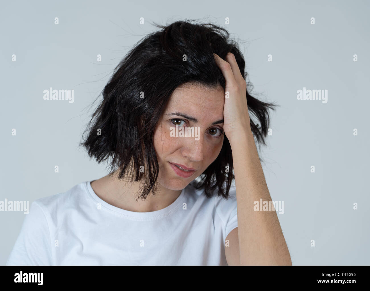 Close up portrait of sad latin woman serious and concerned, looking ...