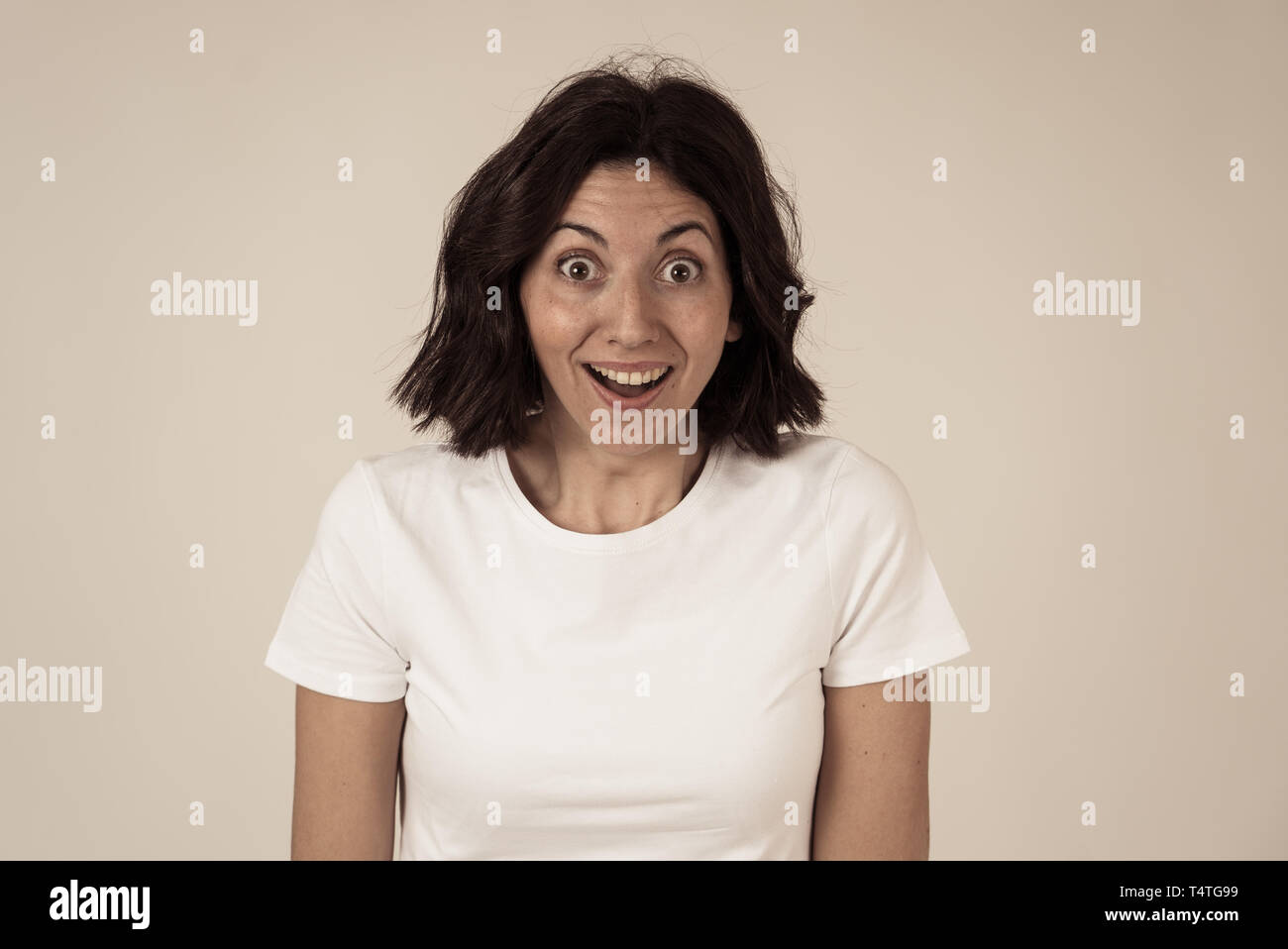 Portrait of beautiful shocked woman hearing good news or having great ...