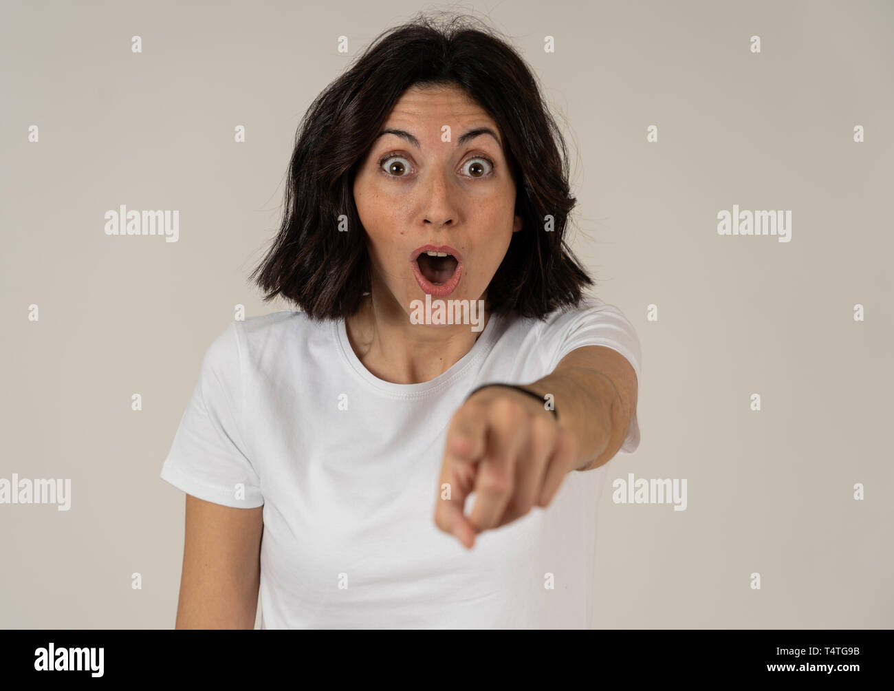Portrait of beautiful shocked woman hearing good news or having great ...