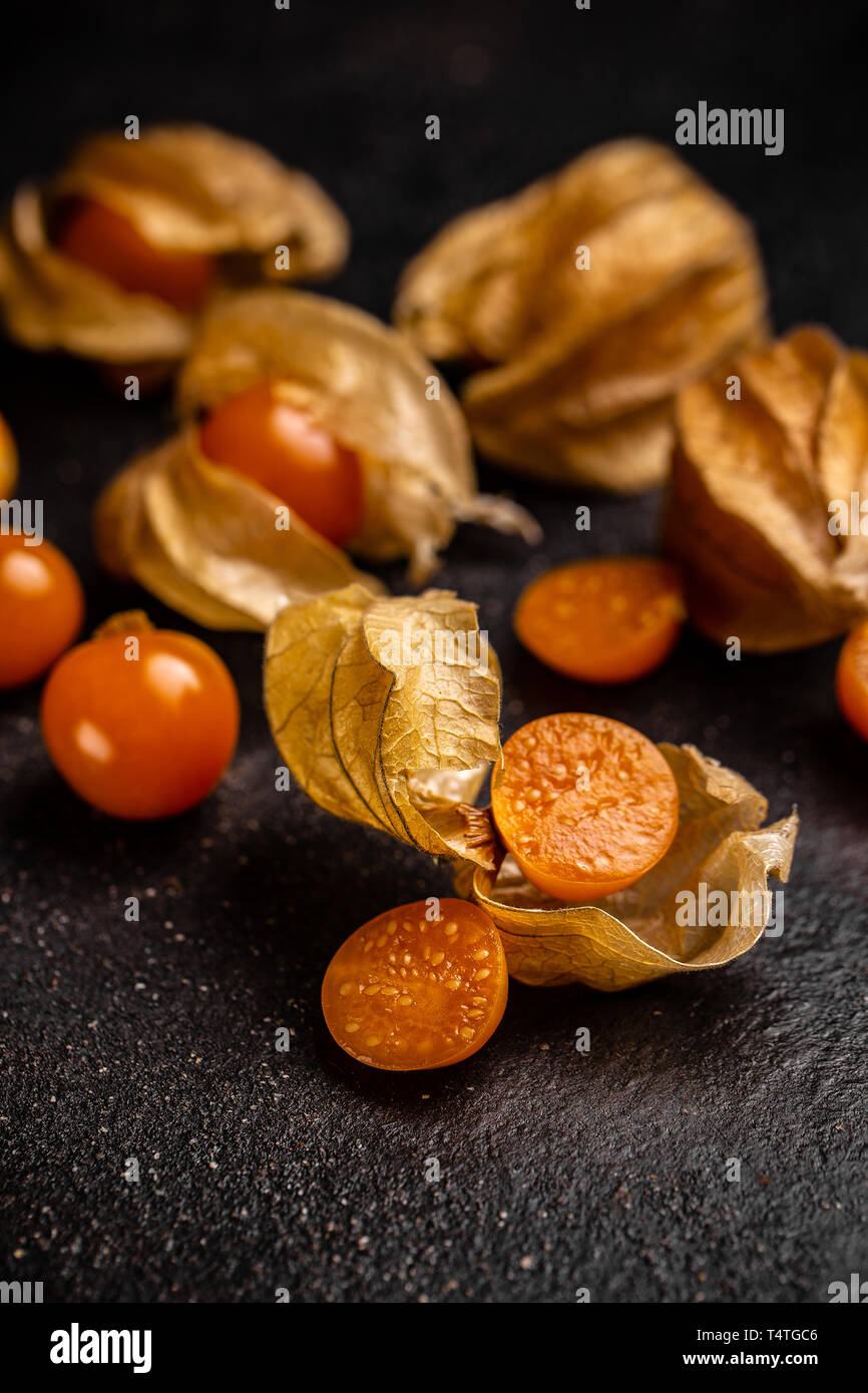 Physalis fruit (Physalis Peruviana) with husk on black background Stock ...