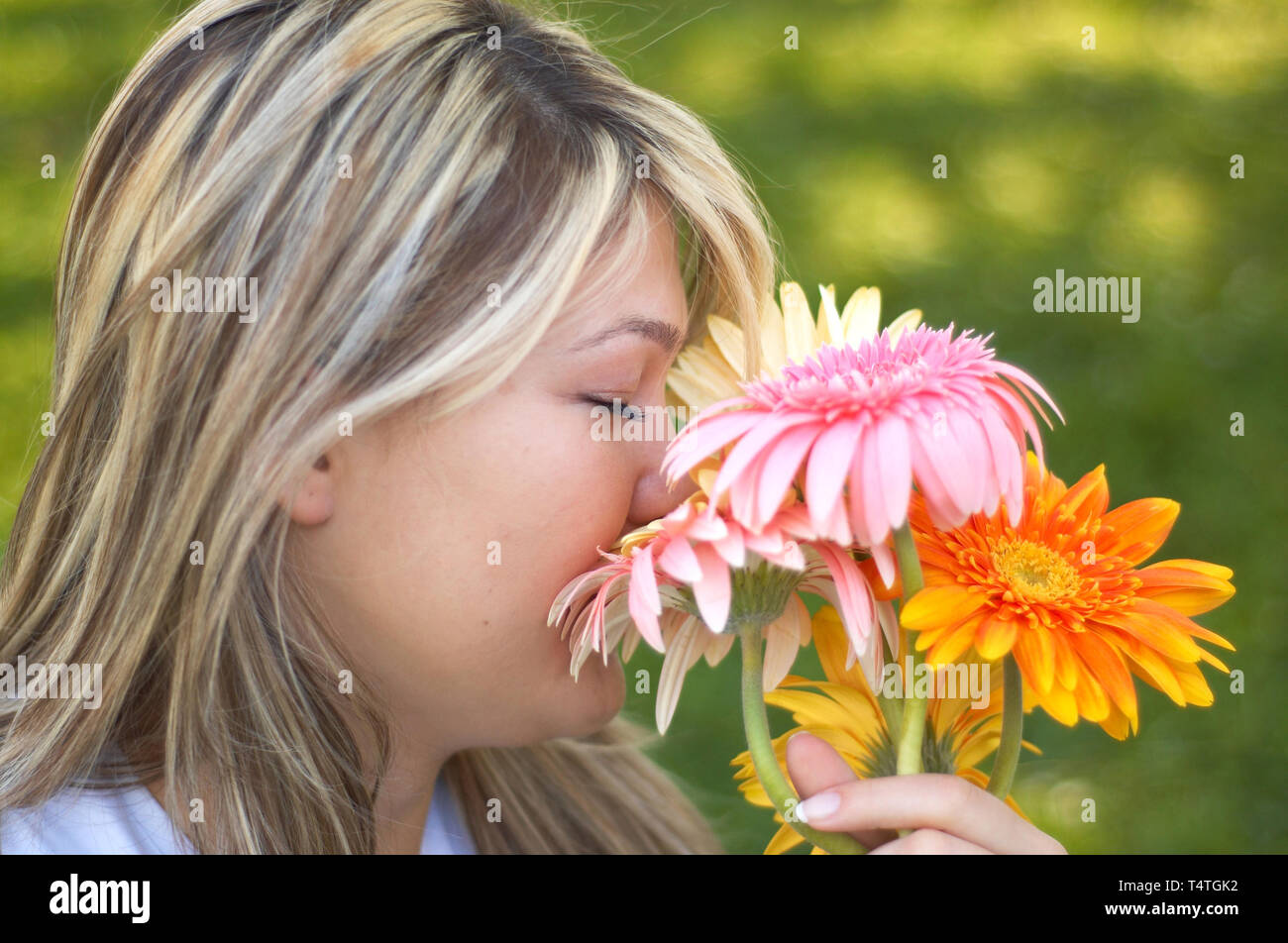 beautiful woman happy with flowers Stock Photo - Alamy