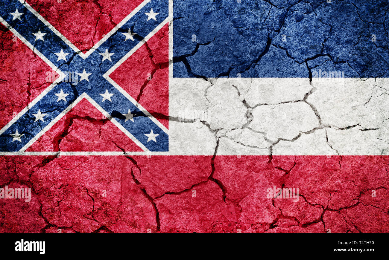 Flag of the state of Mississippi on dry earth ground texture background ...