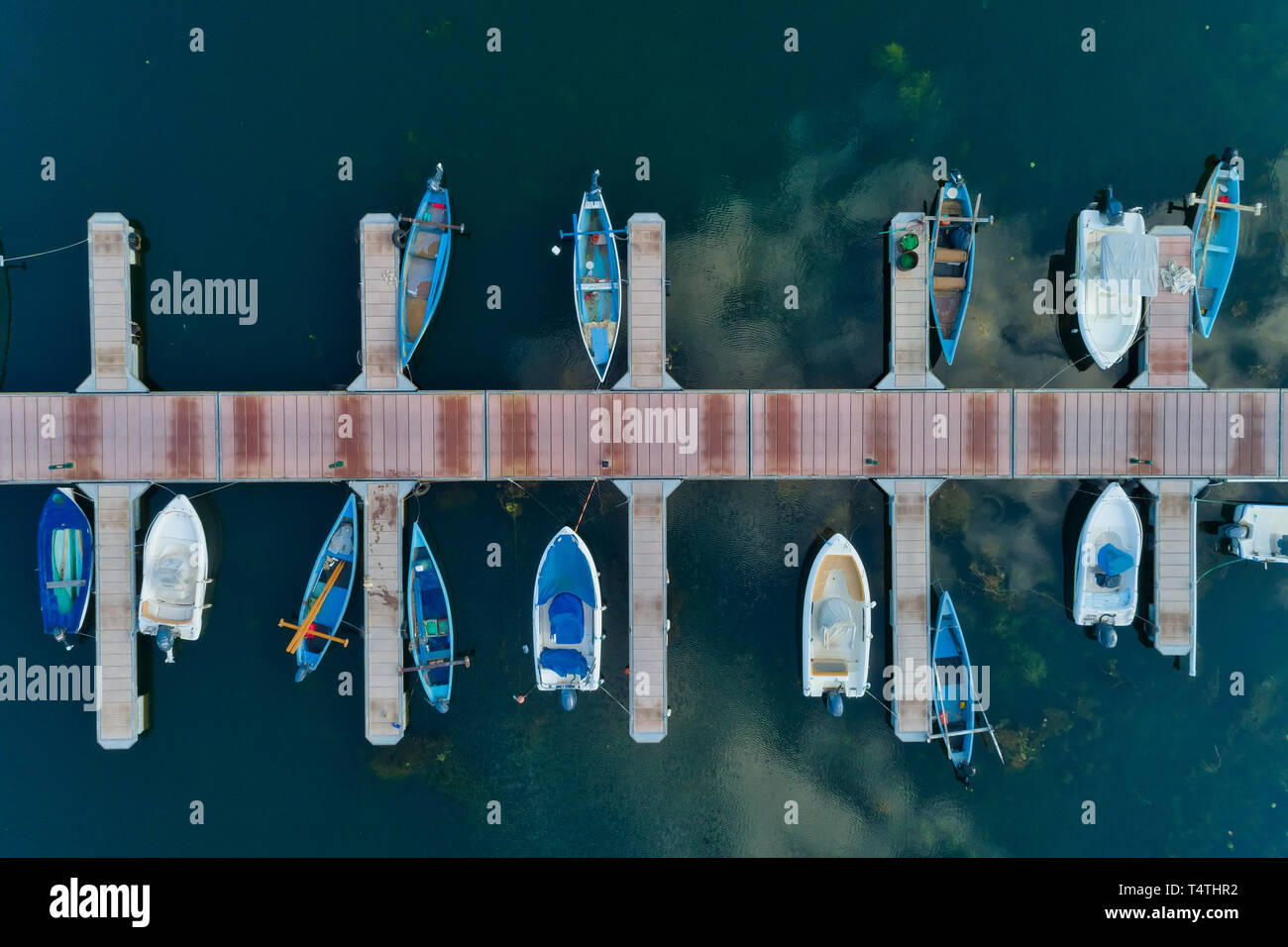 Aerial picture of floating dock with boats, motorboats and vessels ...