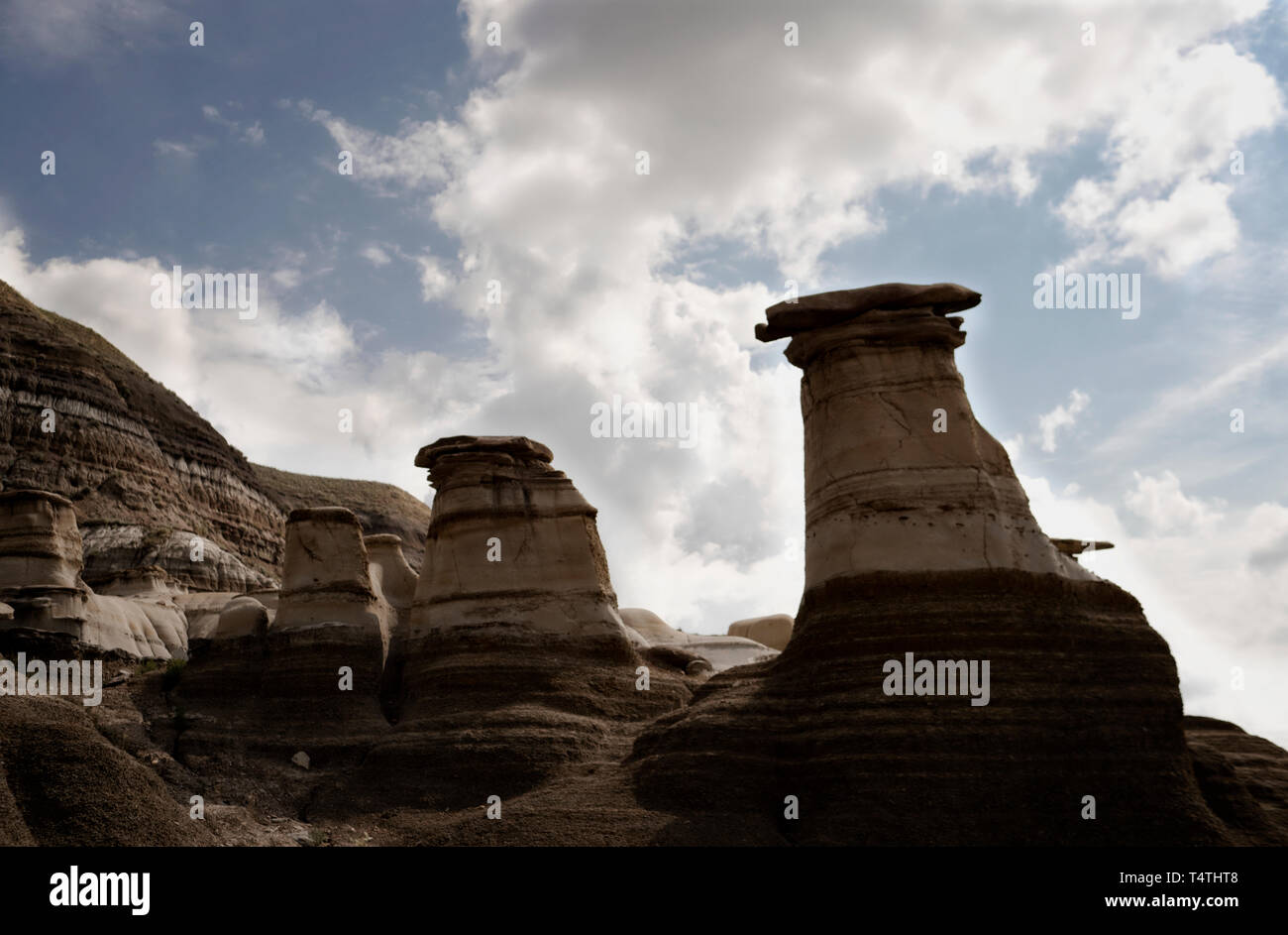 Hoodoos in Drumheller under a summer sky Stock Photo - Alamy