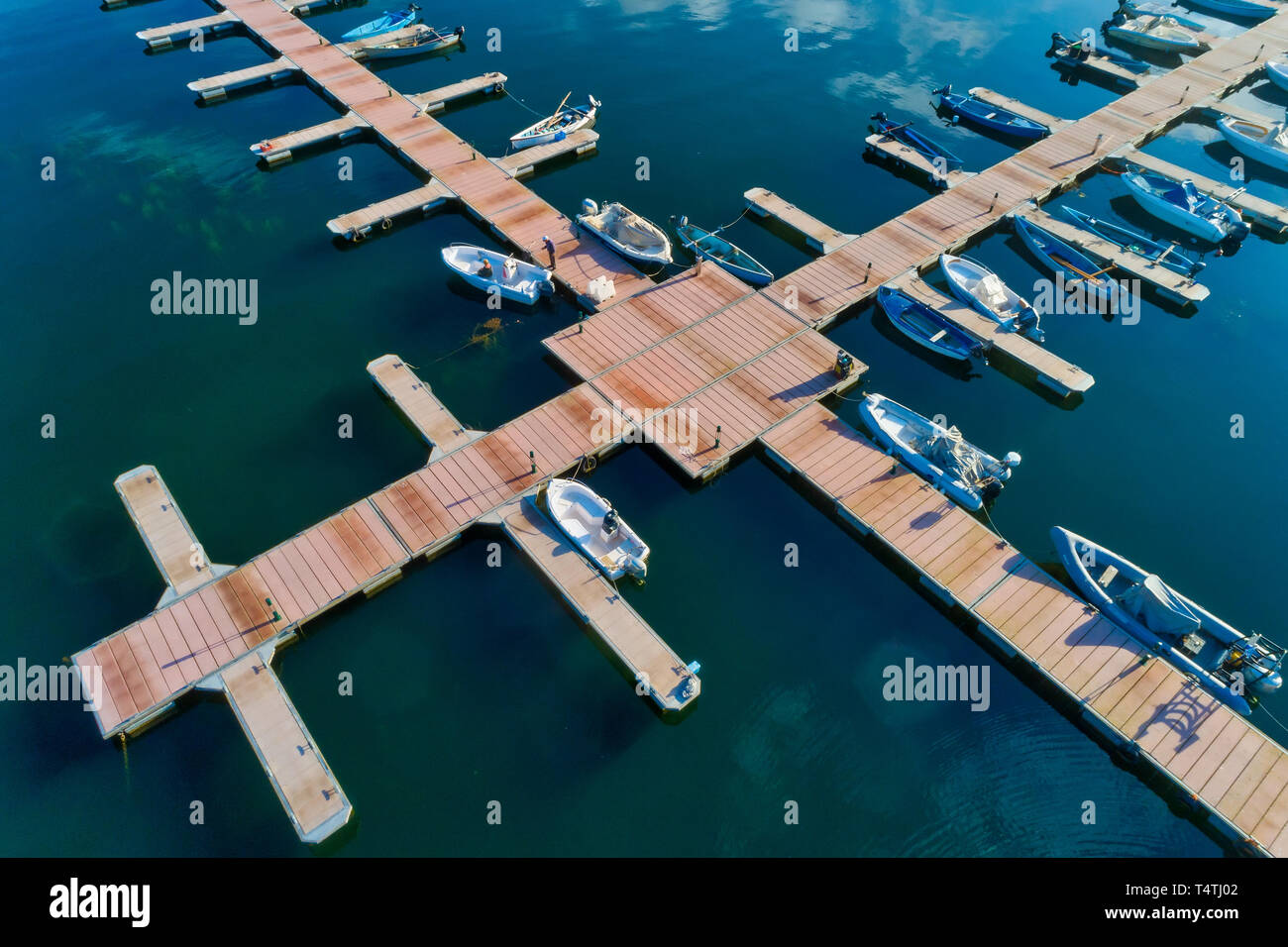 Aerial picture of floating dock with boats, motorboats and vessels ...