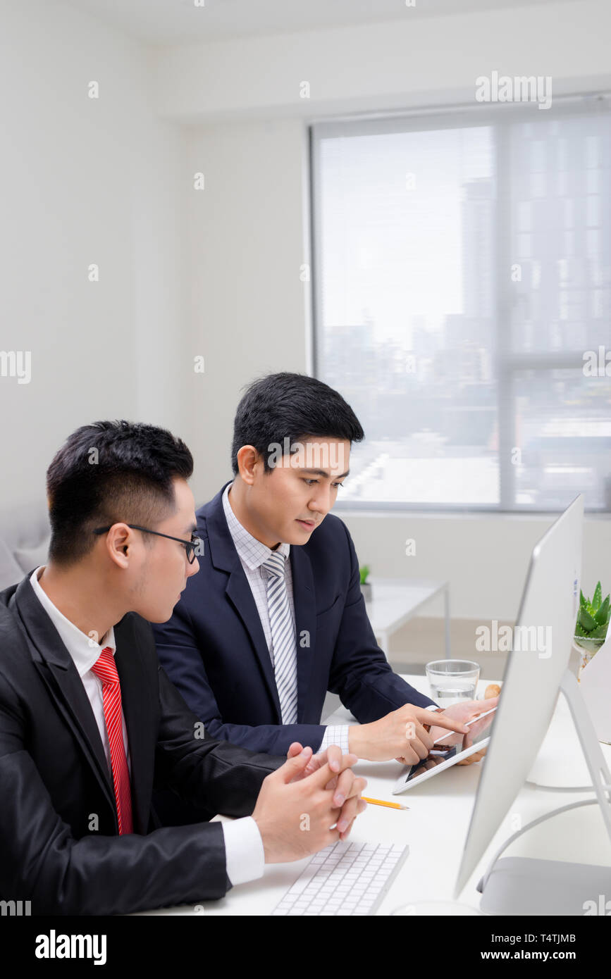 Startup business partners working together in desktop Stock Photo - Alamy