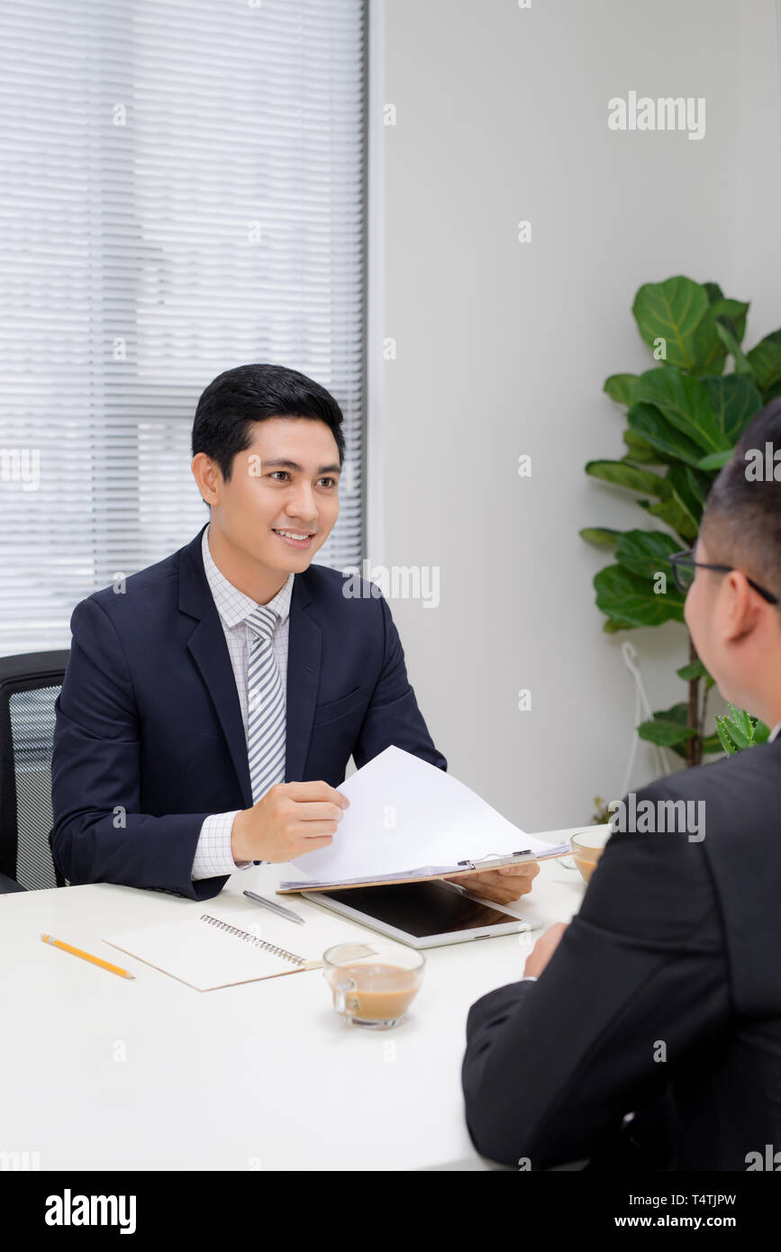 Job interview of two business professionals. Greeting new colleague ...