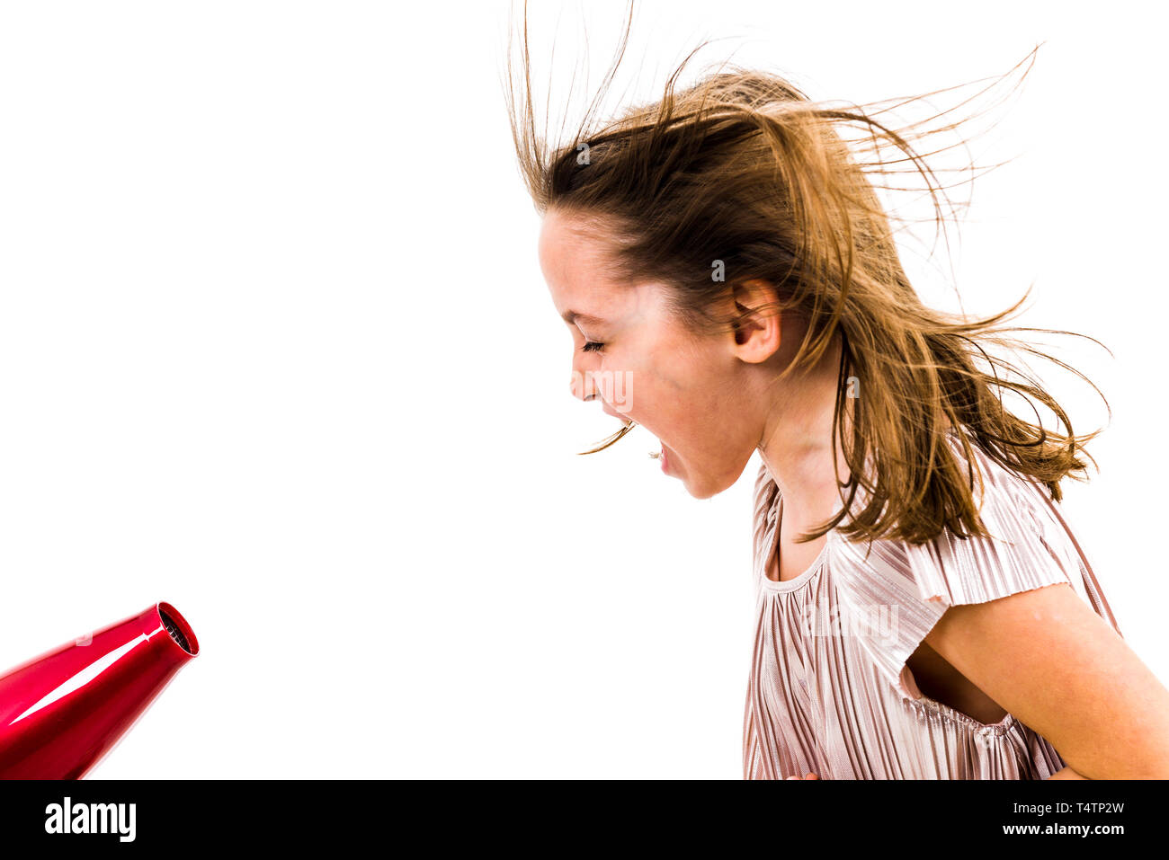 Girl is yelling, shouting at blow dryer - hair dryer. Little girl not ...