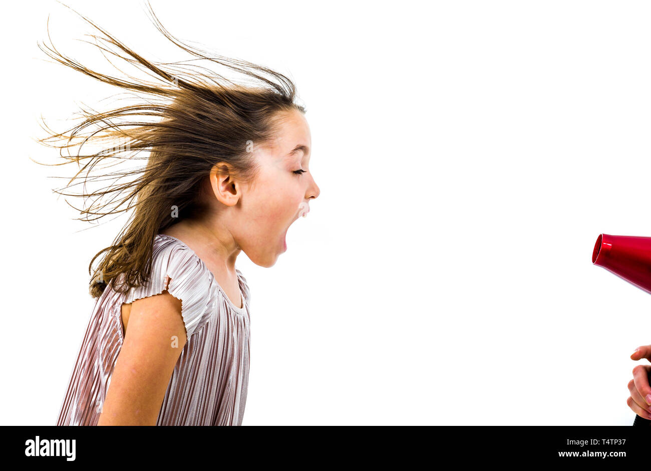 Girl is yelling, shouting at blow dryer - hair dryer. Little girl not ...