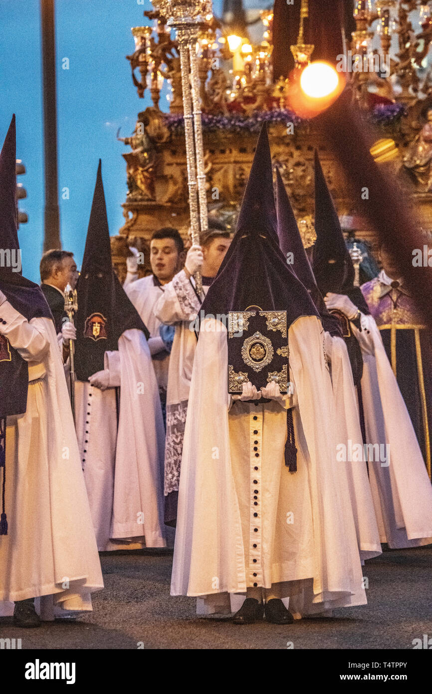 Nazarenos” march with their paso (christ effigy) through the streets of ...