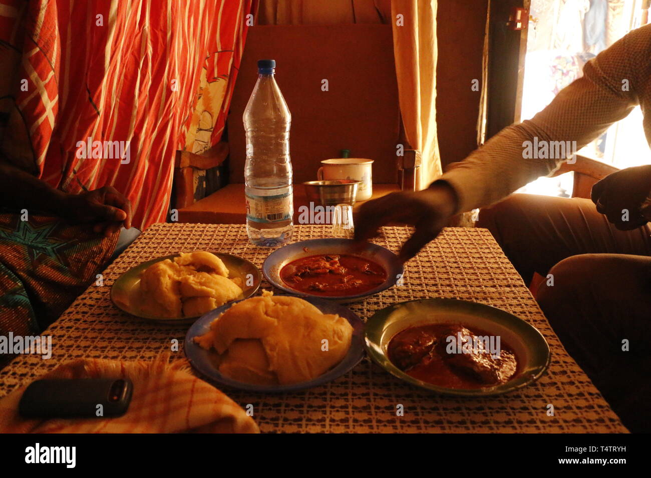 Countryside in Togo, Invited for lunch Stock Photo - Alamy