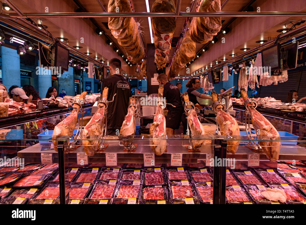 The stalls selling Jamón Serrano, the dry-cured Spanish ham made with ...