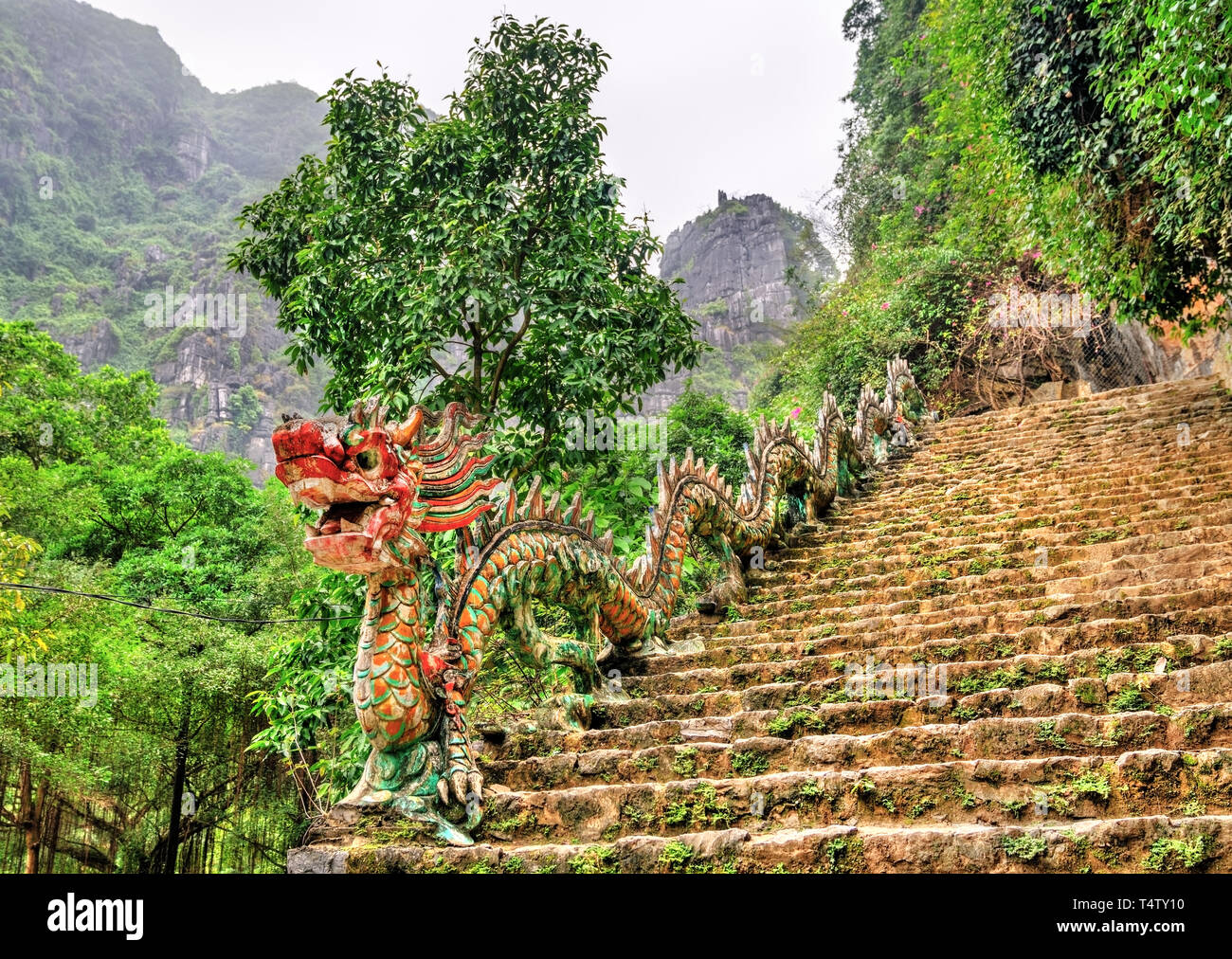 Dragon statue as banister for a stariway leading to Hang Mua viewpoint ...