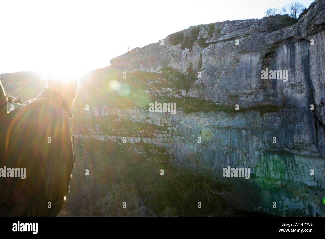 Landscape of rock climbers on Malham Cove at sunset Stock Photo - Alamy