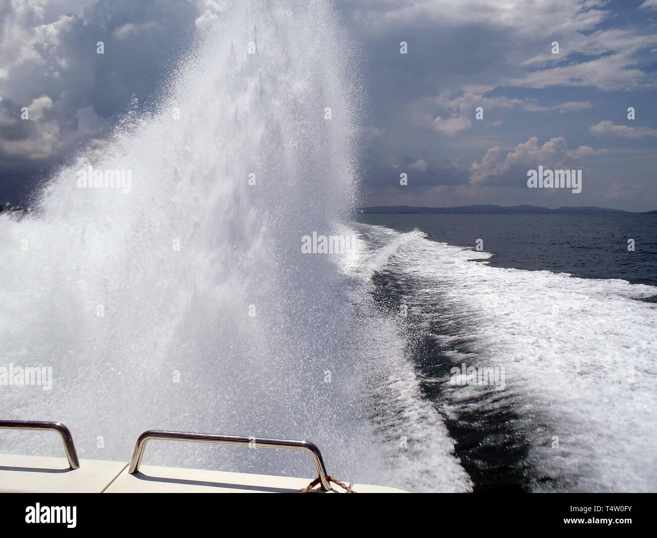 powerful boat splashing water in Cambodia Stock Photo - Alamy