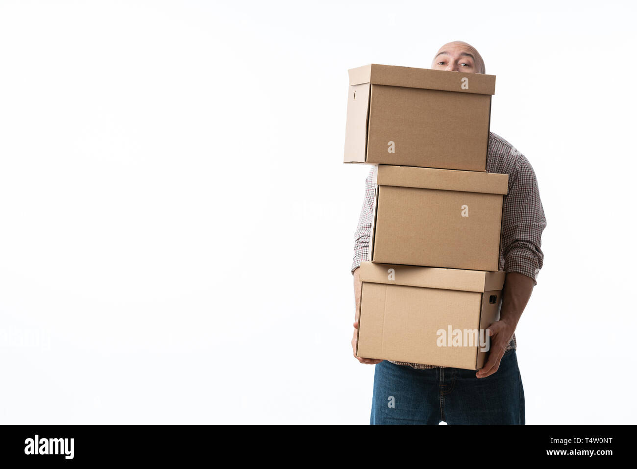 Portrait of a handsome young man holding card boxes, isolated on white ...