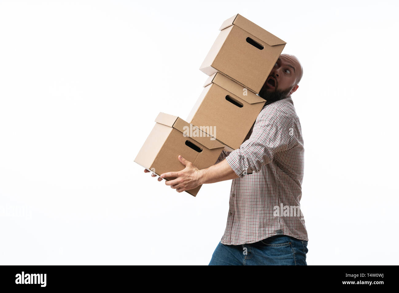 Young man carrying and dropping his stack of moving boxes Stock Photo ...