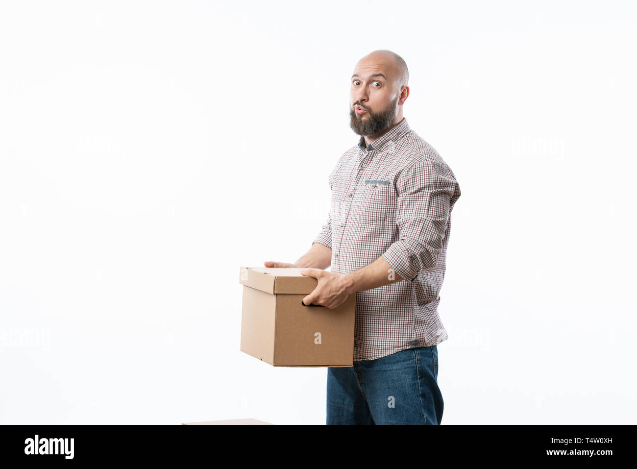 Portrait of a handsome young man holding card boxes, isolated on white ...