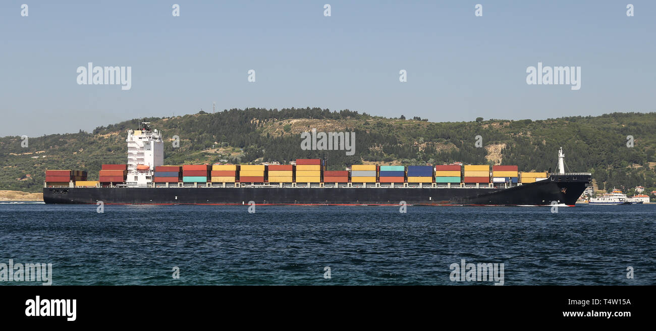 A container ship carrying goods between ports Stock Photo - Alamy