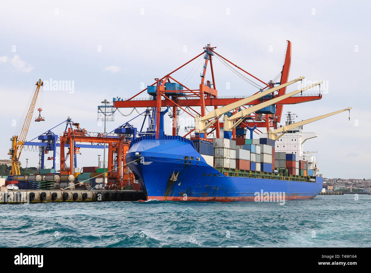 Container Ship is loading in a port Stock Photo - Alamy