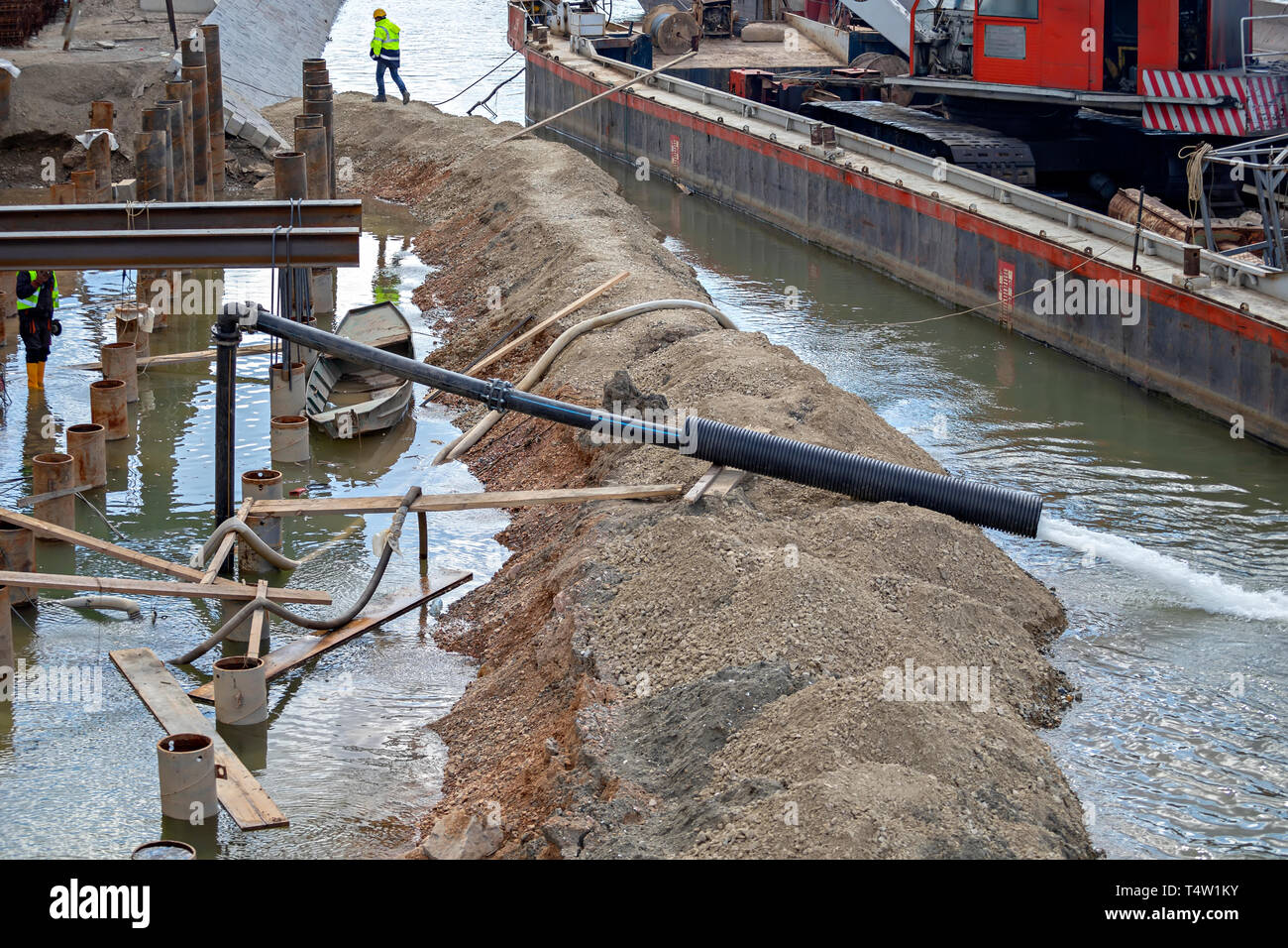 Pump high pressure working at river bank. Stream of water from the ...