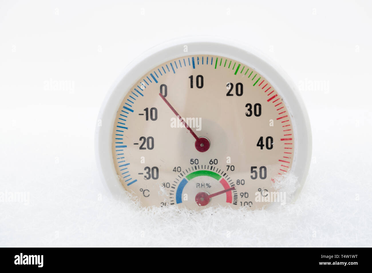 Thermometer on snow shows low temperatures in celsius. Winter time ...
