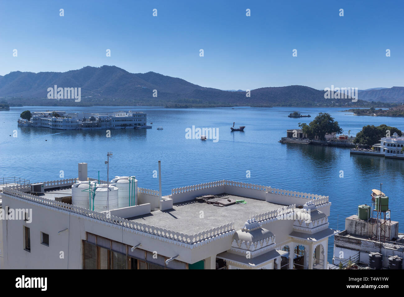 Udaipur rooftop view floating palace Stock Photo - Alamy