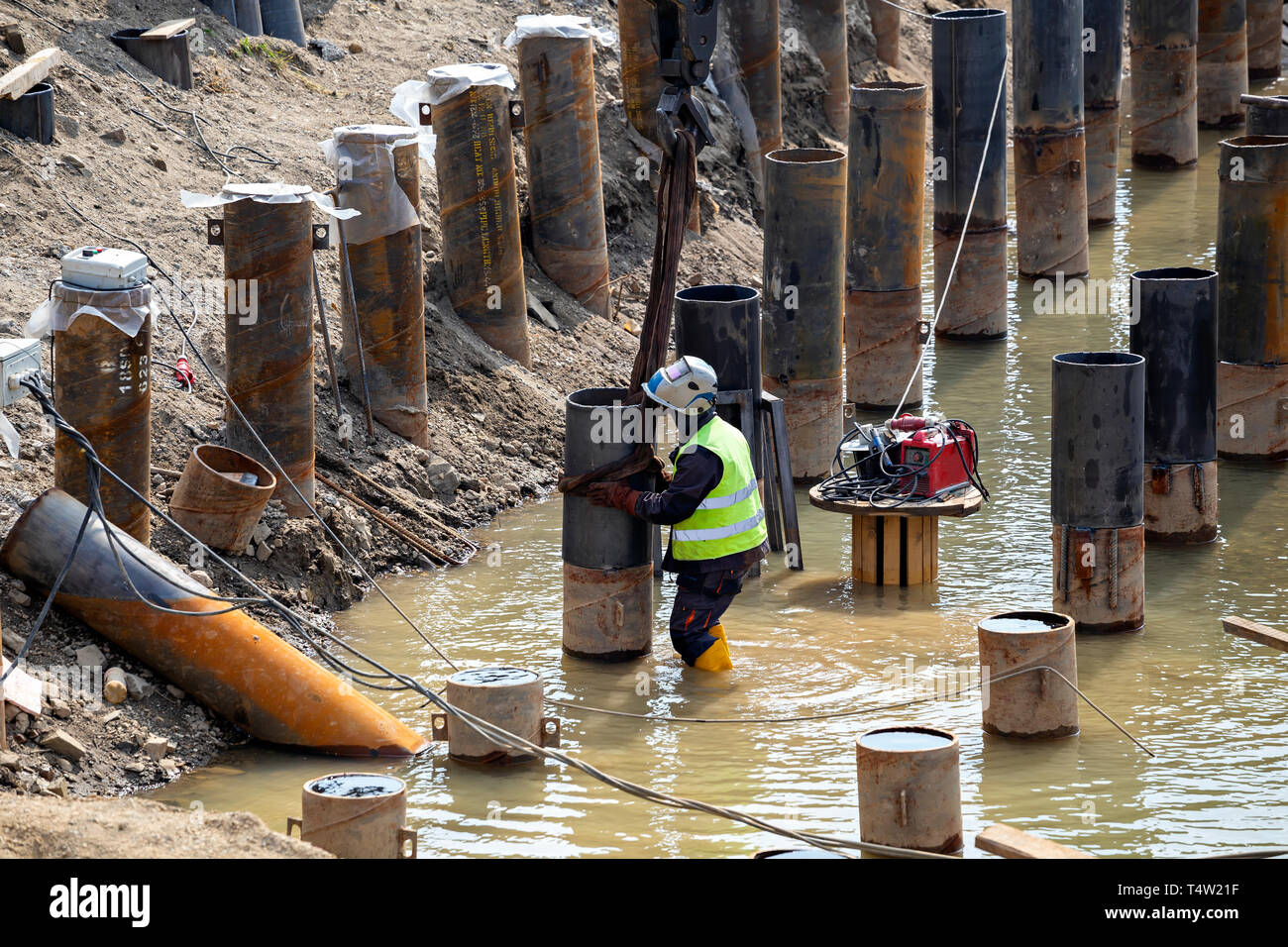 River bank revetment construction site. Welding industrial construction ...
