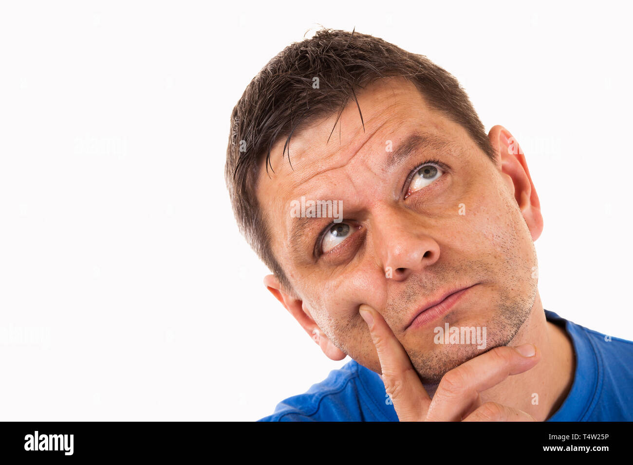 A man looks thoughtfully upwards - isolated Stock Photo - Alamy