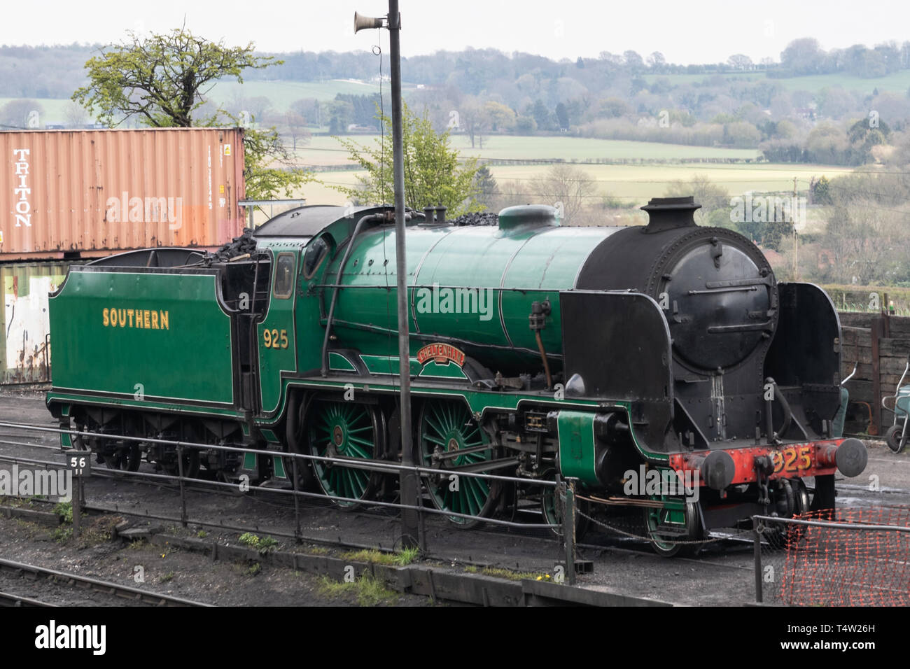 Old Green southern railway steam engine on the tracks at the mid hants ...