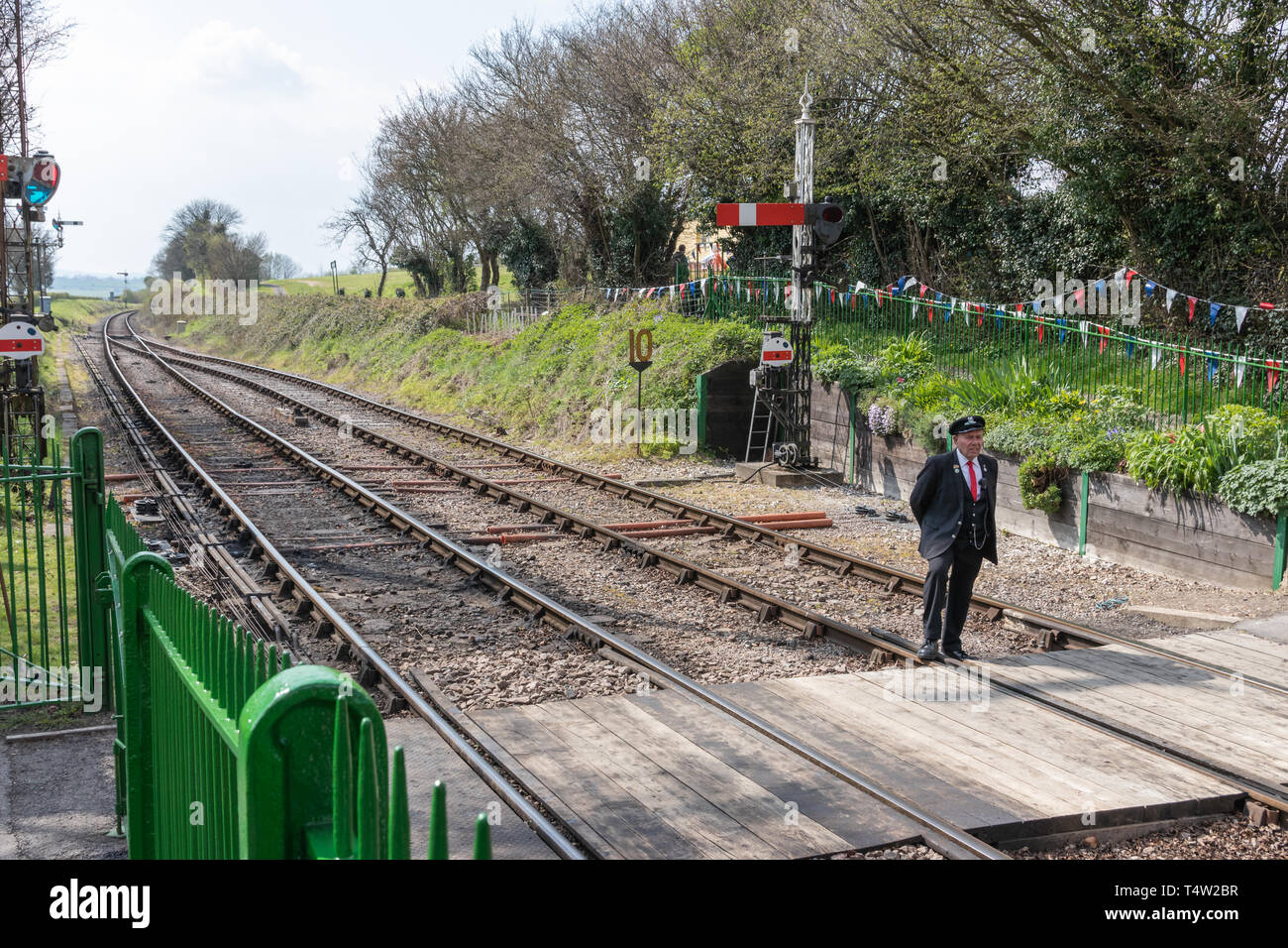 Train guard on old railway station, Mid Hants railway, Hampshire Stock ...