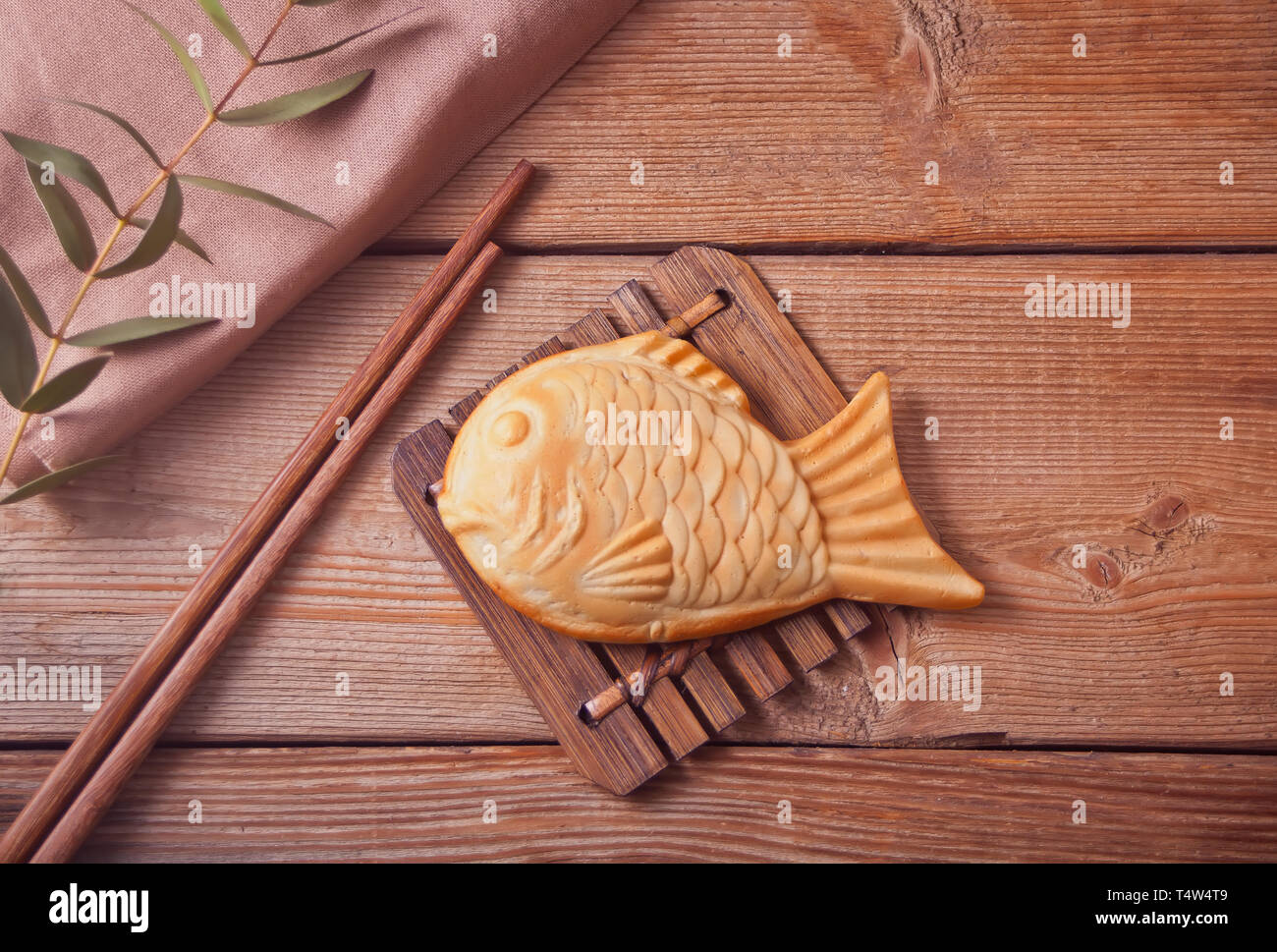 Taiyaki Japanese street food fish-shaped sweet waffle on wooden table ...