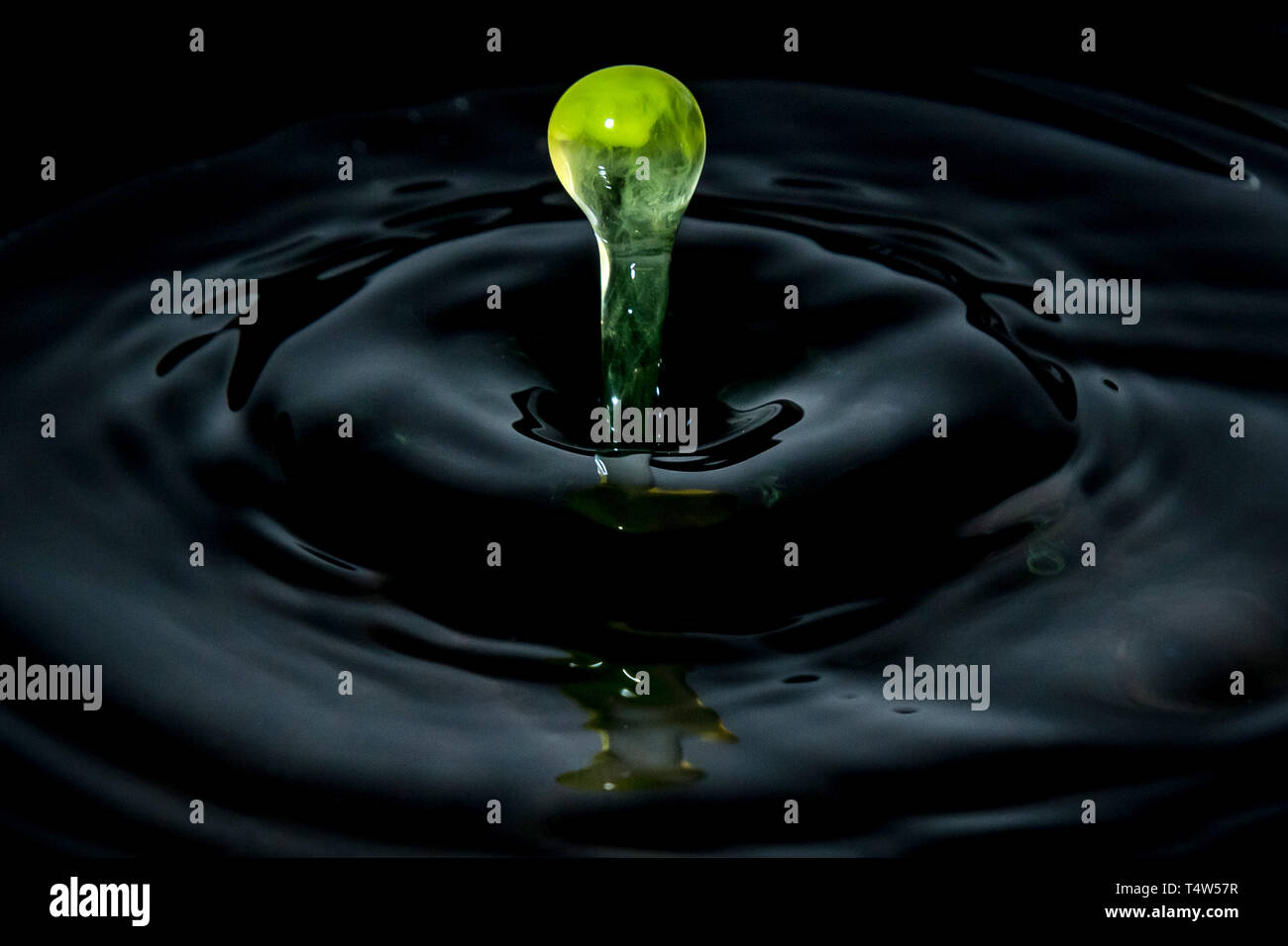 water drop splash with black backgrounds Stock Photo - Alamy