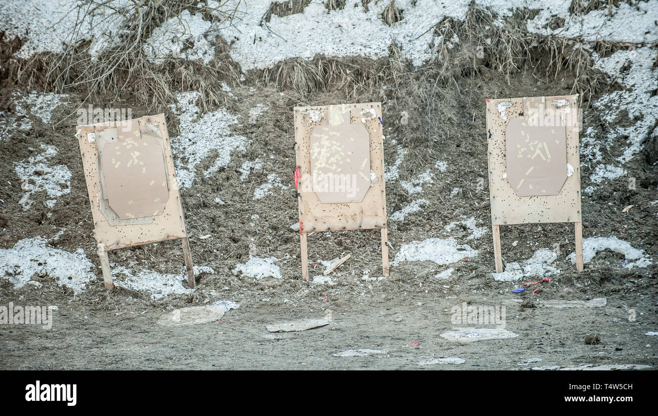 Target center after shooting with shotgun bullet gauge pellets. Outdoor ...