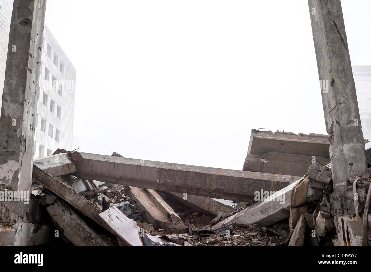 The destroyed big concrete building in a foggy haze. The remains of the ...